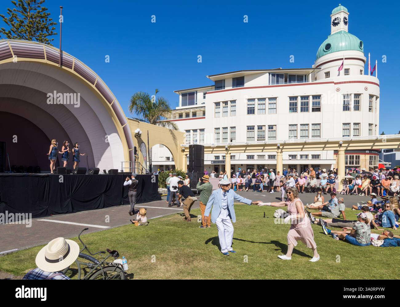 People in 1930s costumes dance outside the historic soundshell in ...