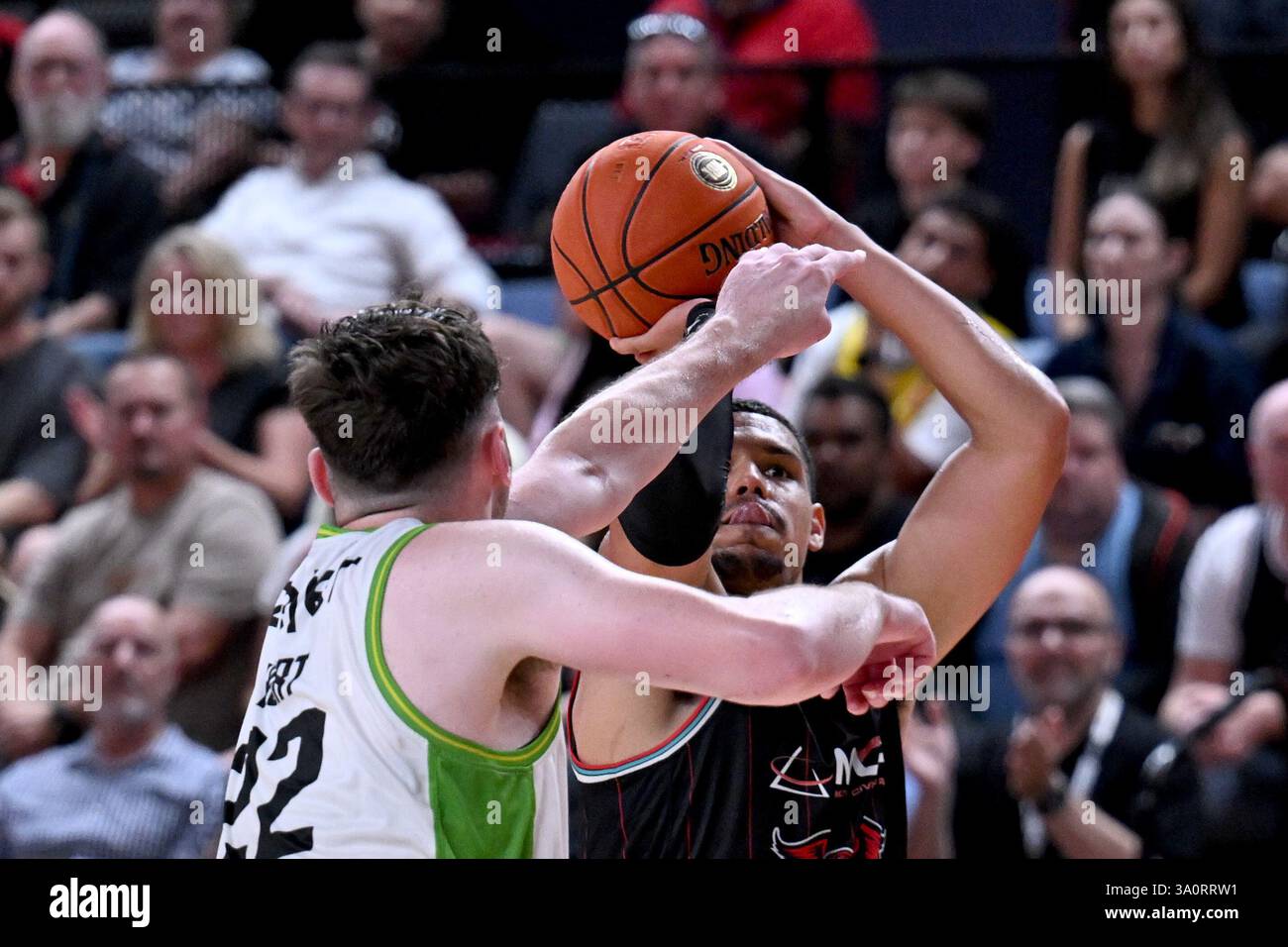 Trey Kell III of the Hawks takes a shot as Matt Hurt of the Phoenix ...