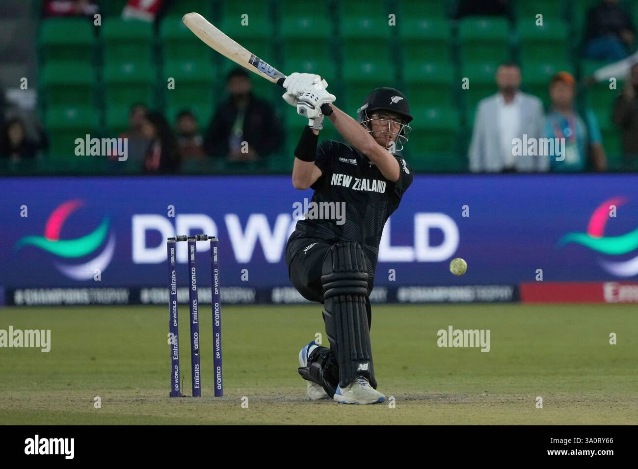 New Zealand's captain Mitchel Santner plays a shot during the ICC ...