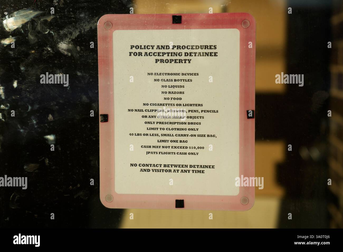 Signage is posted on the door of a United States Immigration and ...