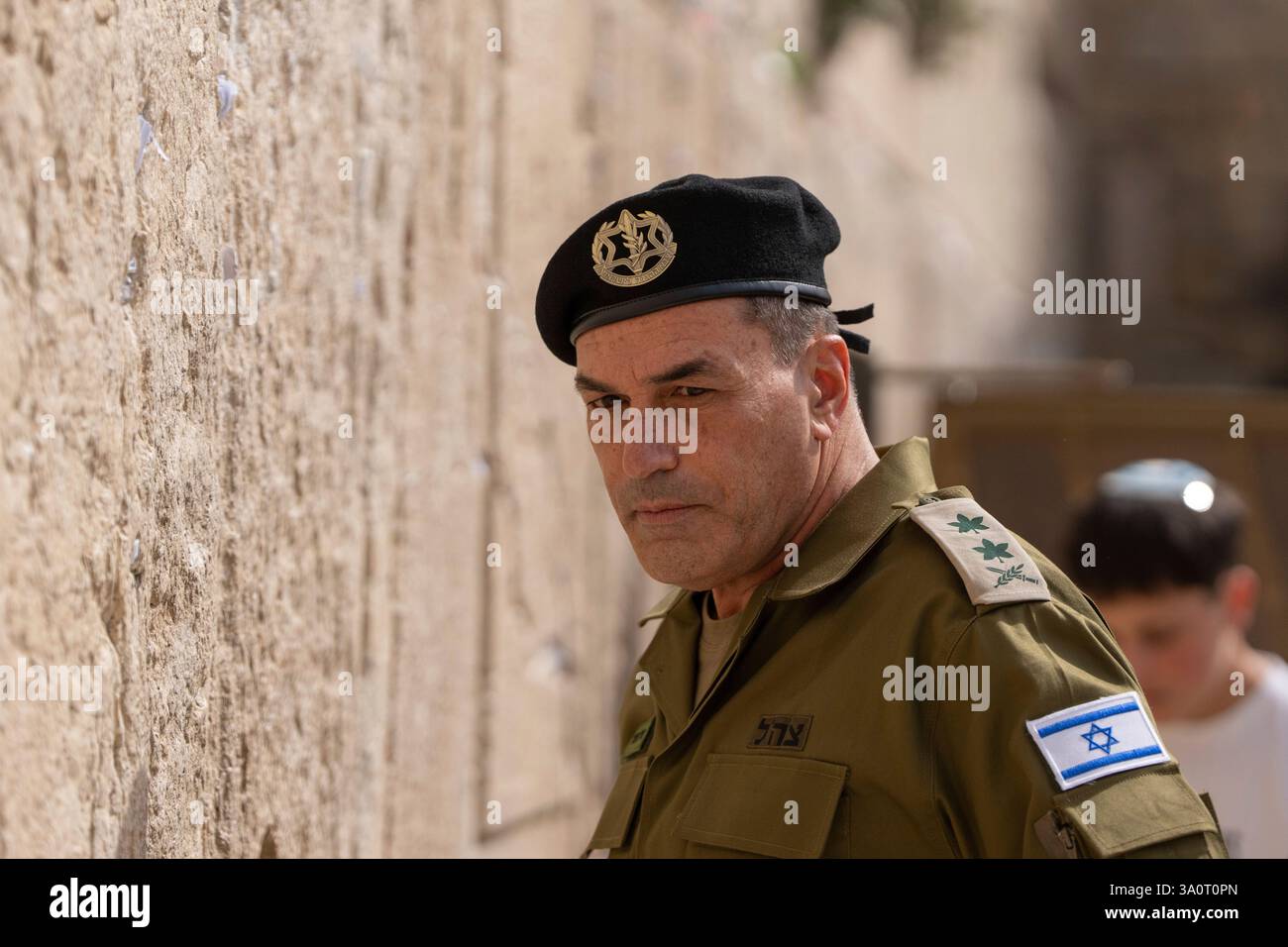 Israel's incoming military chief of staff, Lt. Gen. Eyal Zamir places ...