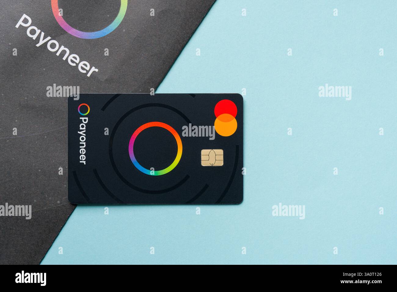 Antalya, Turkey - March 5, 2025: Top view of the payment card of the Payoneer payment system ...