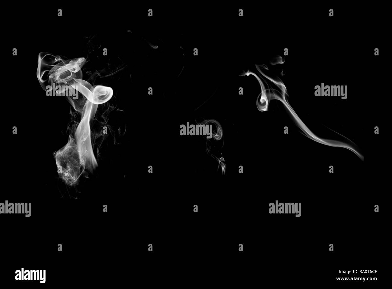 In the photo, various forms of smoke are shown rising upwards and ...