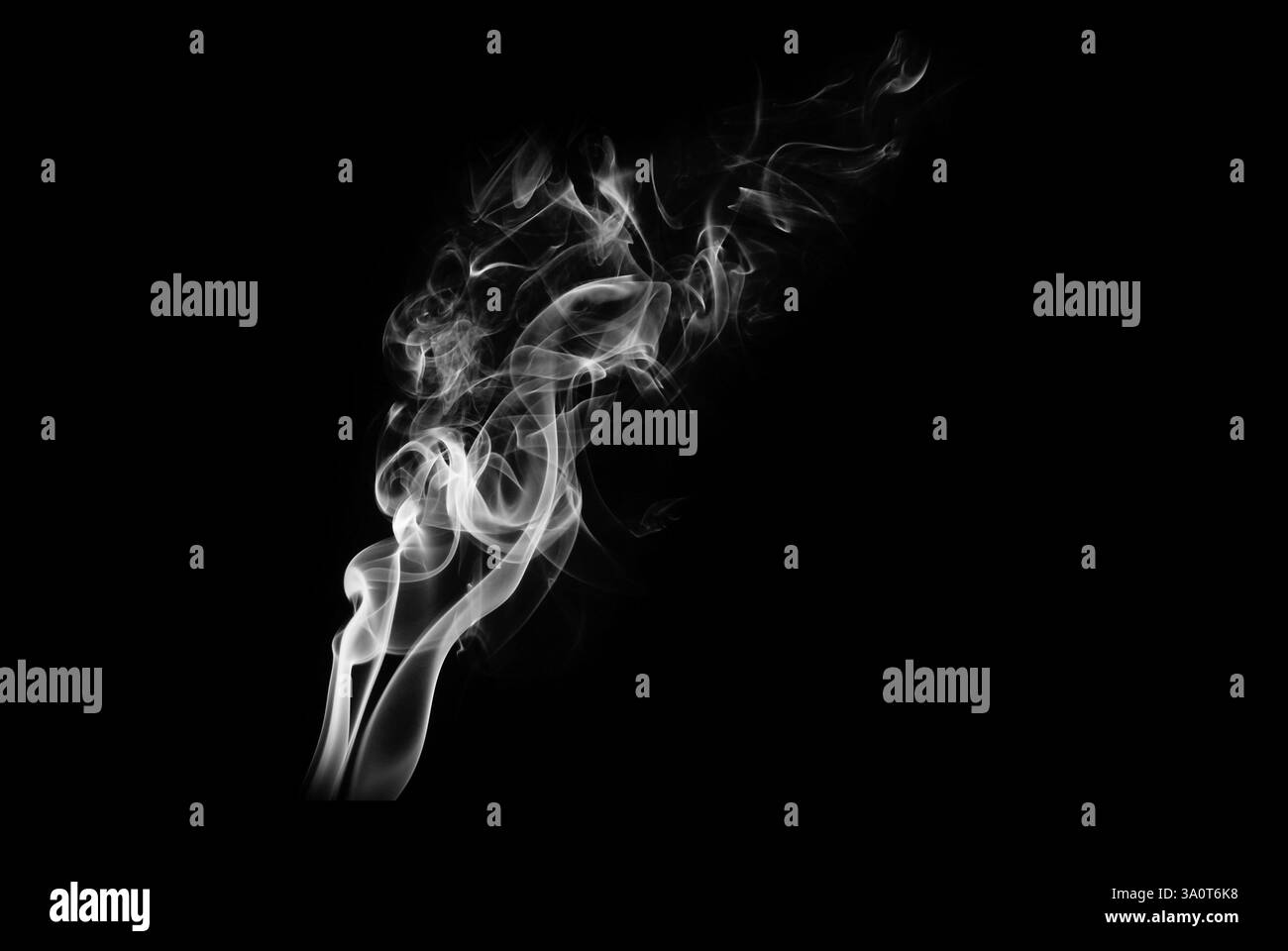 In the photo, various forms of smoke are shown rising upwards and ...