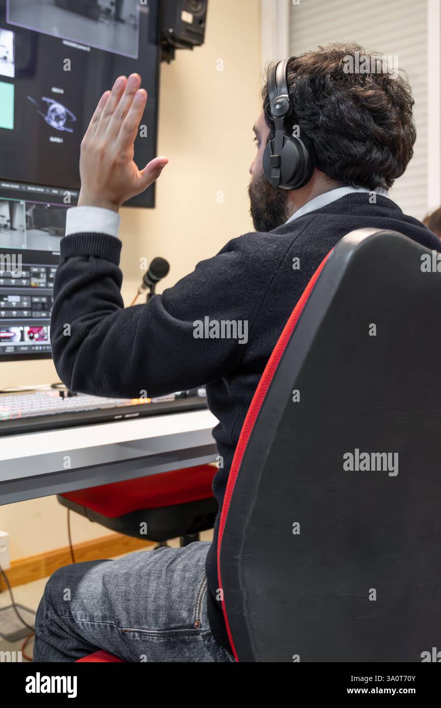 Security guard watching video monitoring surveillance security system ...