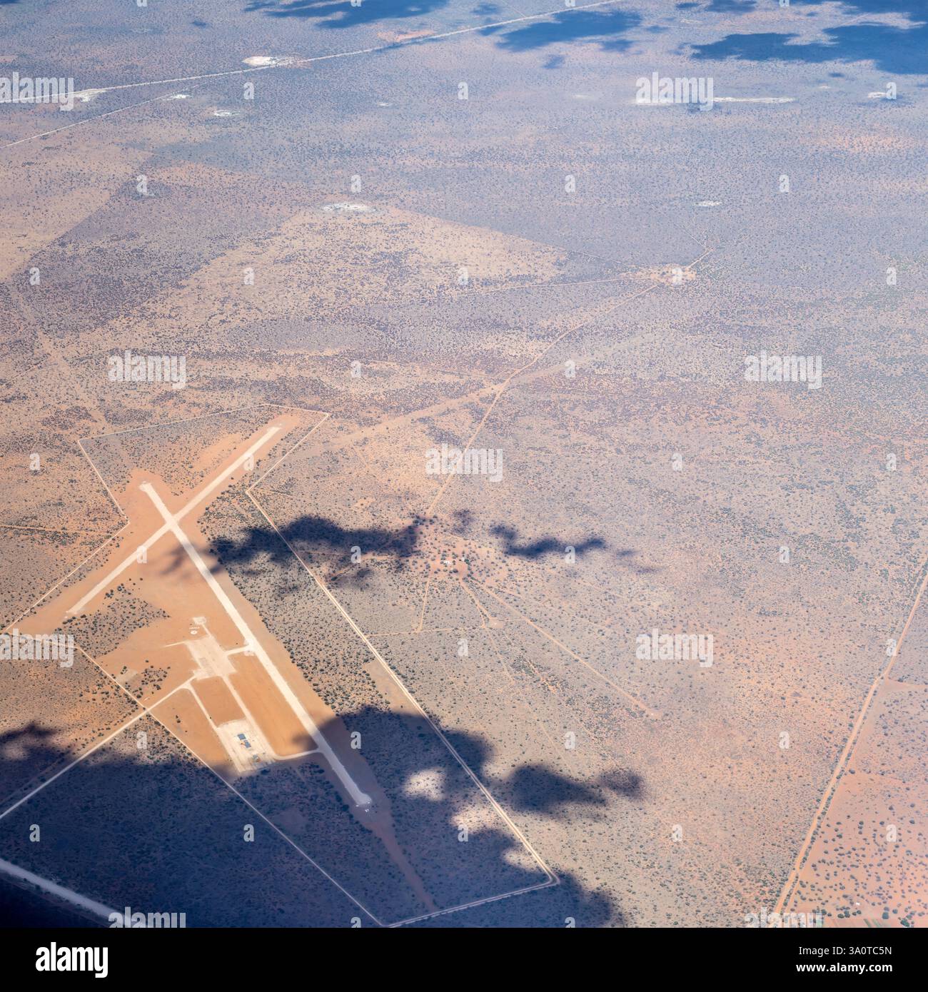 aerial landscape with airport in desert, shot from a glider plane in ...