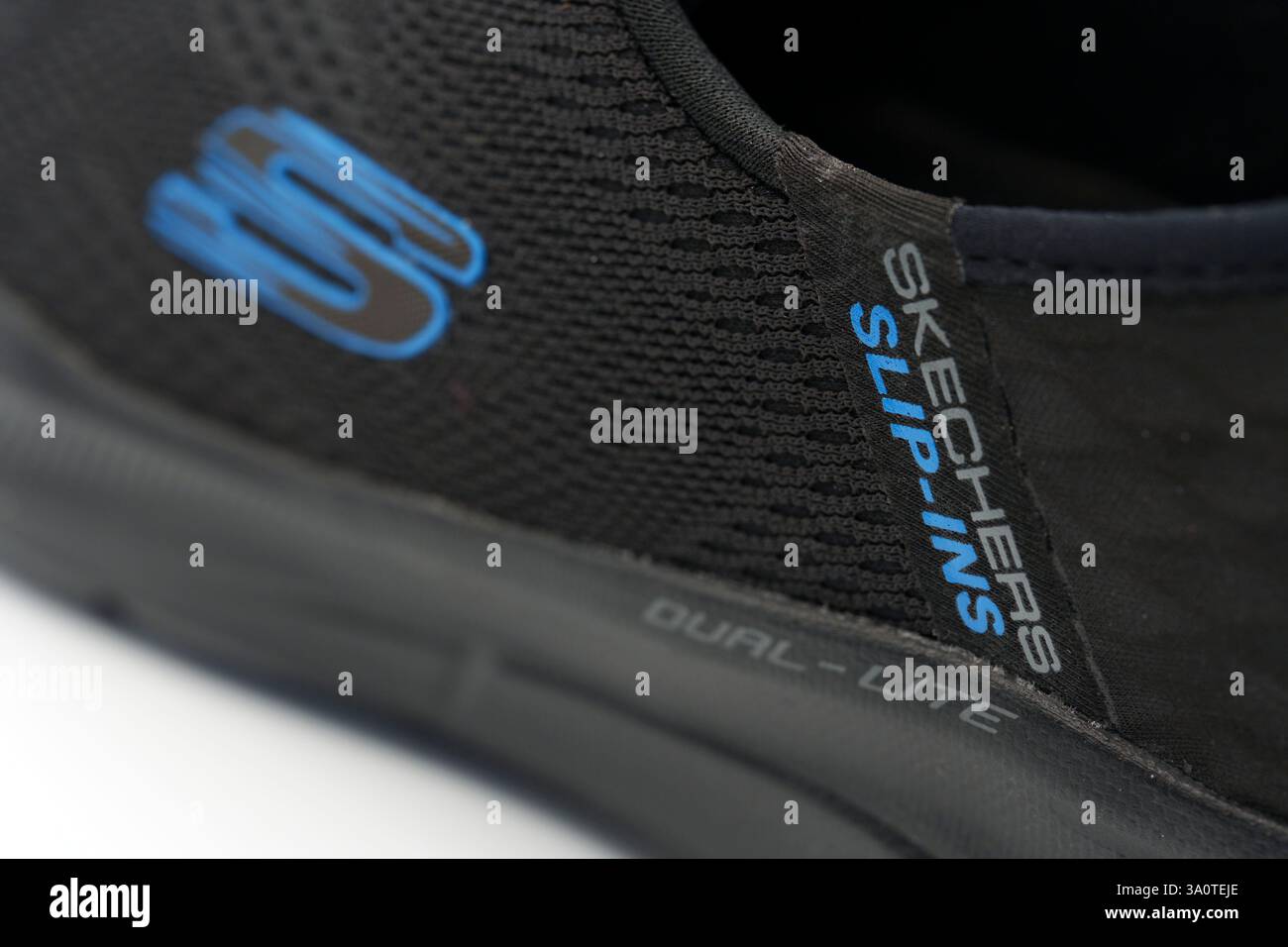 Close-up detail of branding on a black Skechers Slip-ins shoe Stock ...