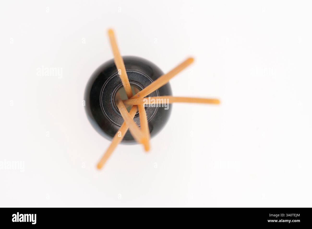 Aroma diffuser glass bottle with reed sticks cut out isolated on white ...