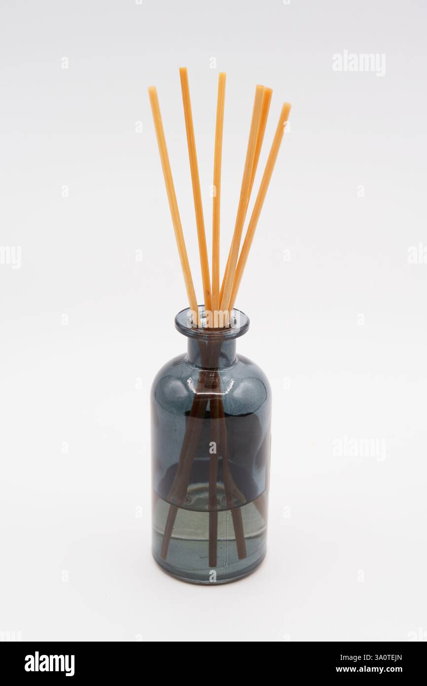 Aroma diffuser glass bottle with reed sticks cut out isolated on white ...
