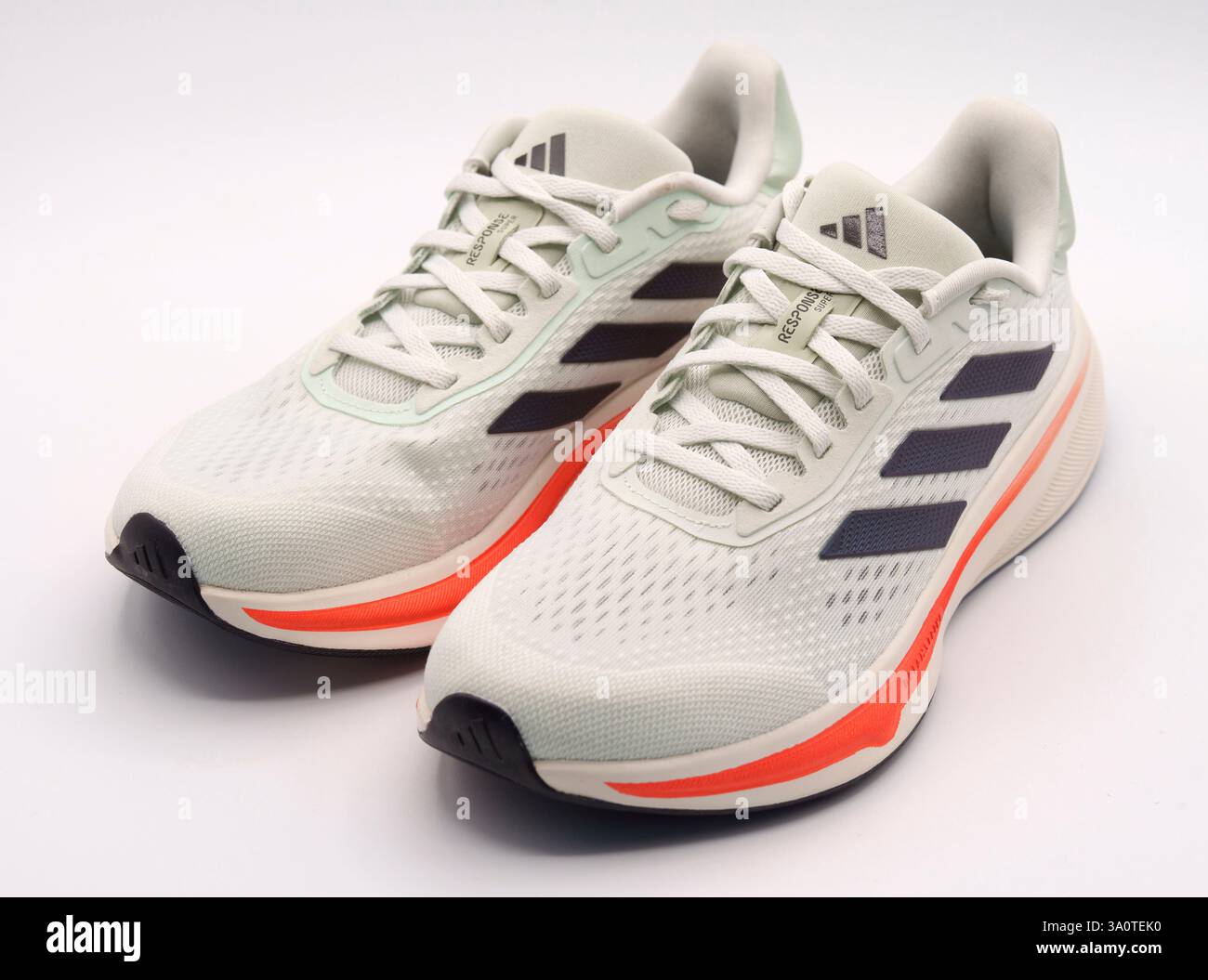 Pair of white Adidas Response Super running shoes cut out isolated on ...
