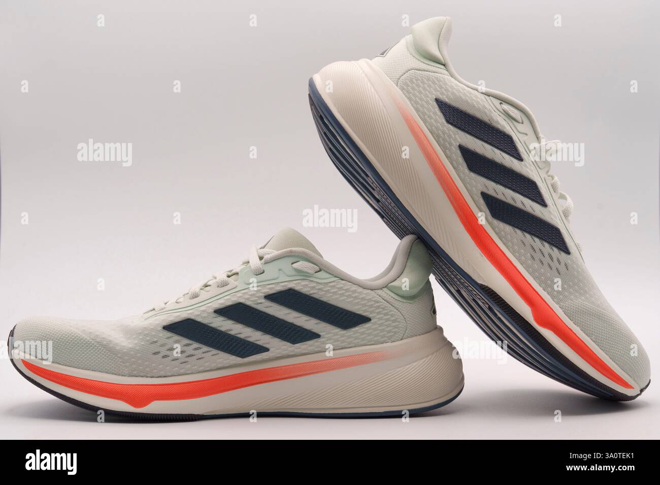 Pair of white Adidas Response Super running shoes cut out isolated on ...