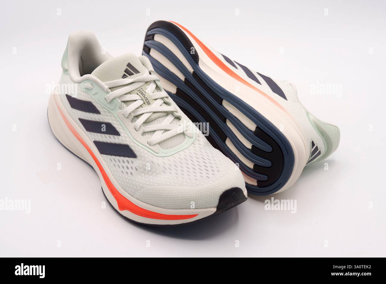 Pair of white Adidas Response Super running shoes cut out isolated on ...