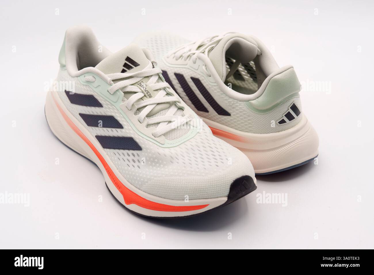 Pair of white Adidas Response Super running shoes cut out isolated on ...