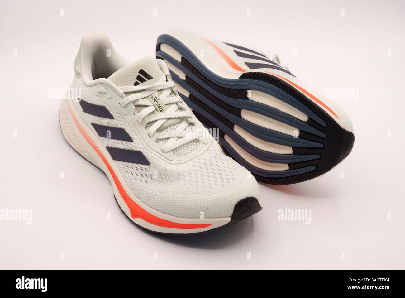 Pair of white Adidas Response Super running shoes cut out isolated on ...