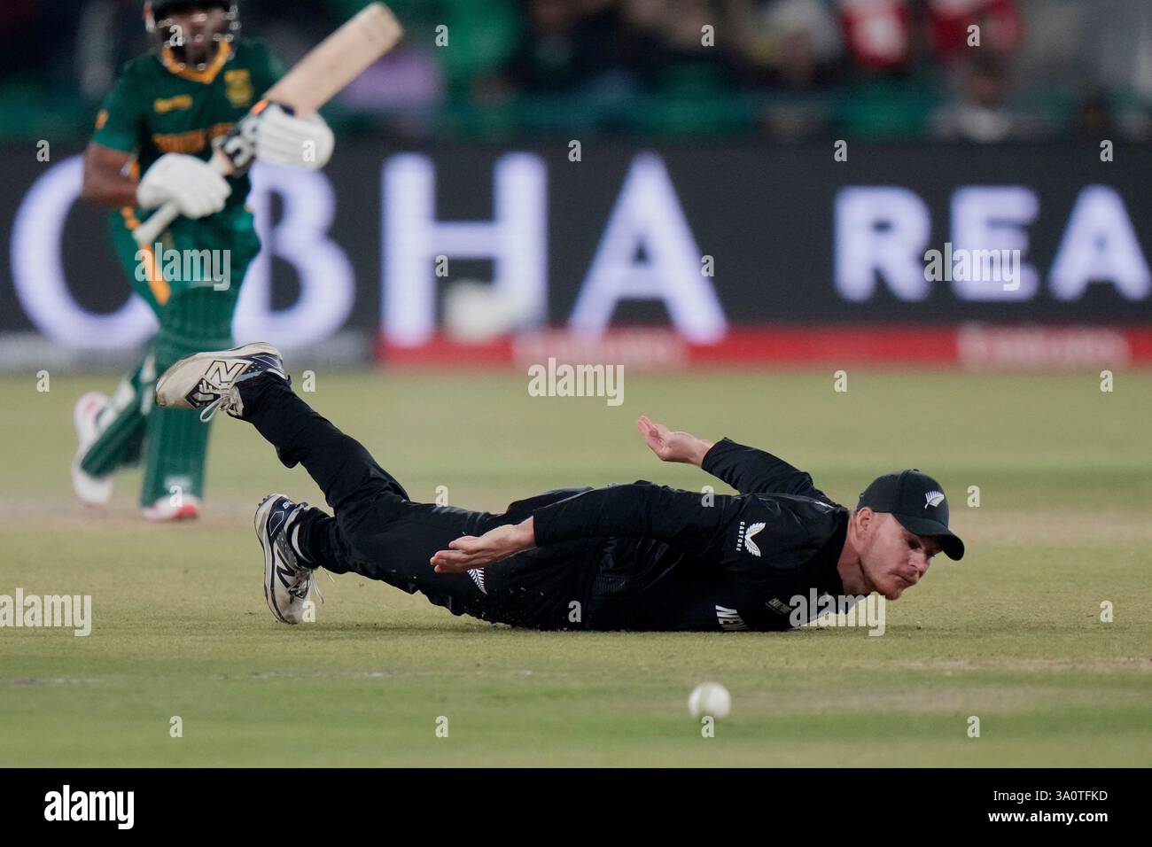 New Zealand's Glenn Phillips dives to field the ball during the ICC ...