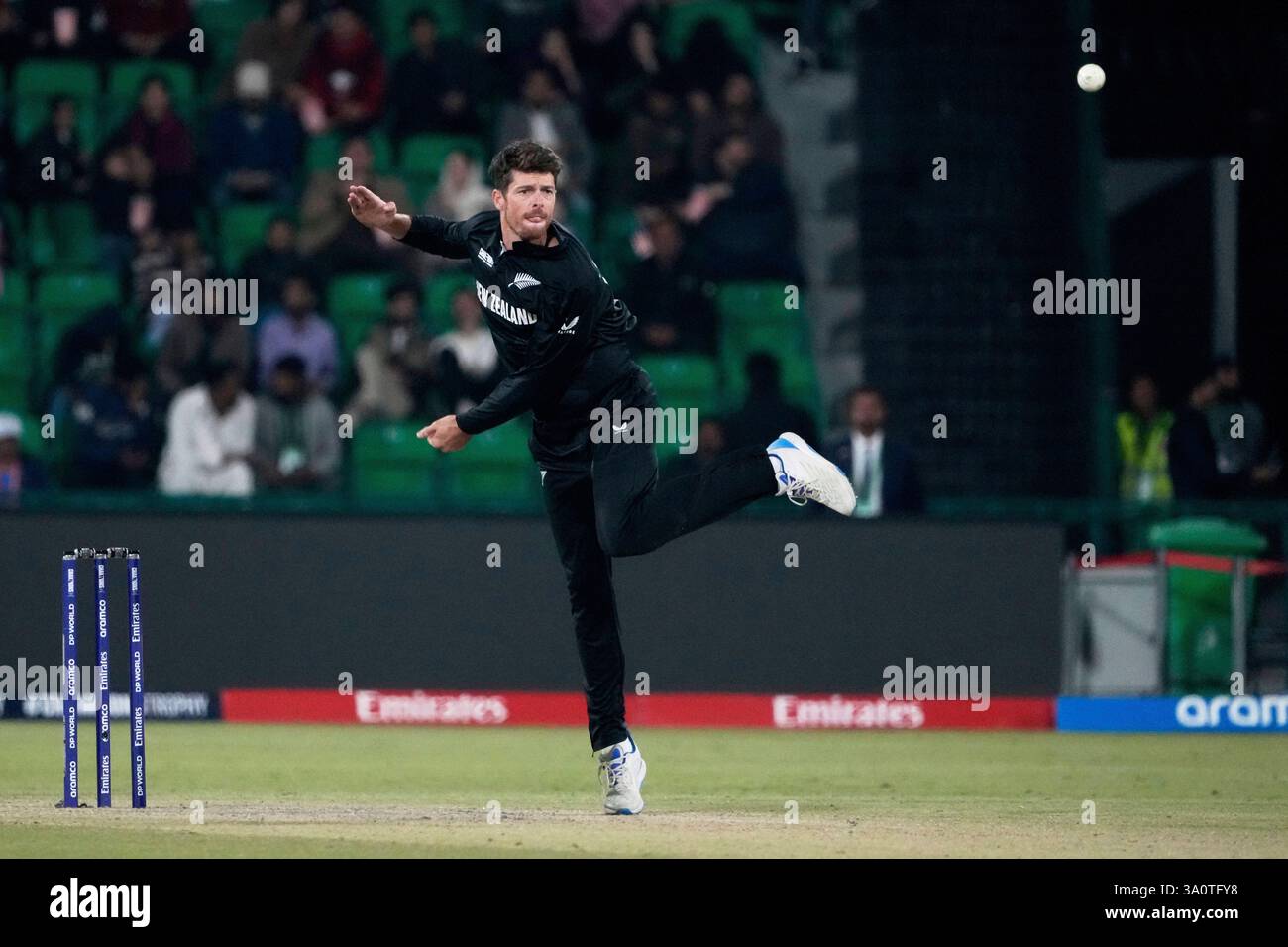 New Zealand's captain Mitchel Santner bowls a delivery during the ICC ...