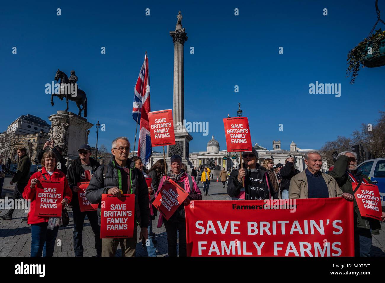 Protesters hold placards and a banner saying "Save Britain's Family ...