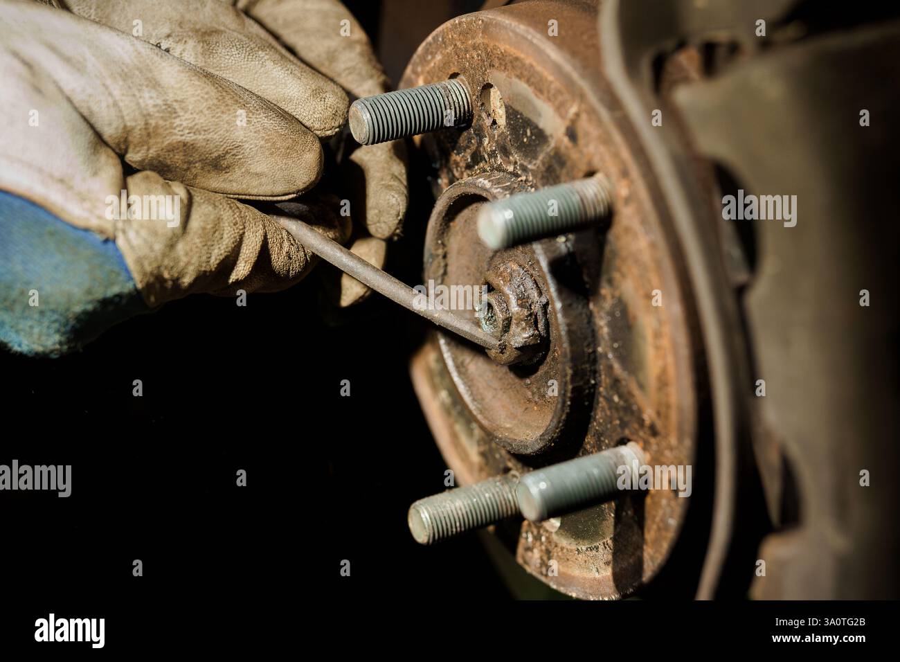Close-Up Image of a Mechanic Wearing Gloves Repairing and Inspecting ...