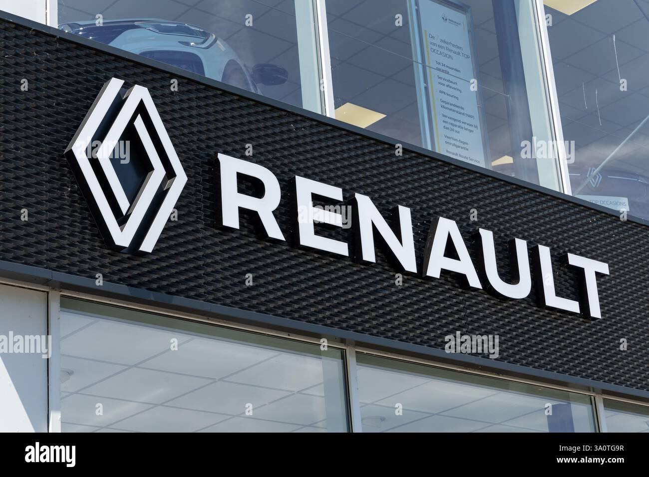 Renault logo sign at the cardealer. Renault produces a range of cars ...