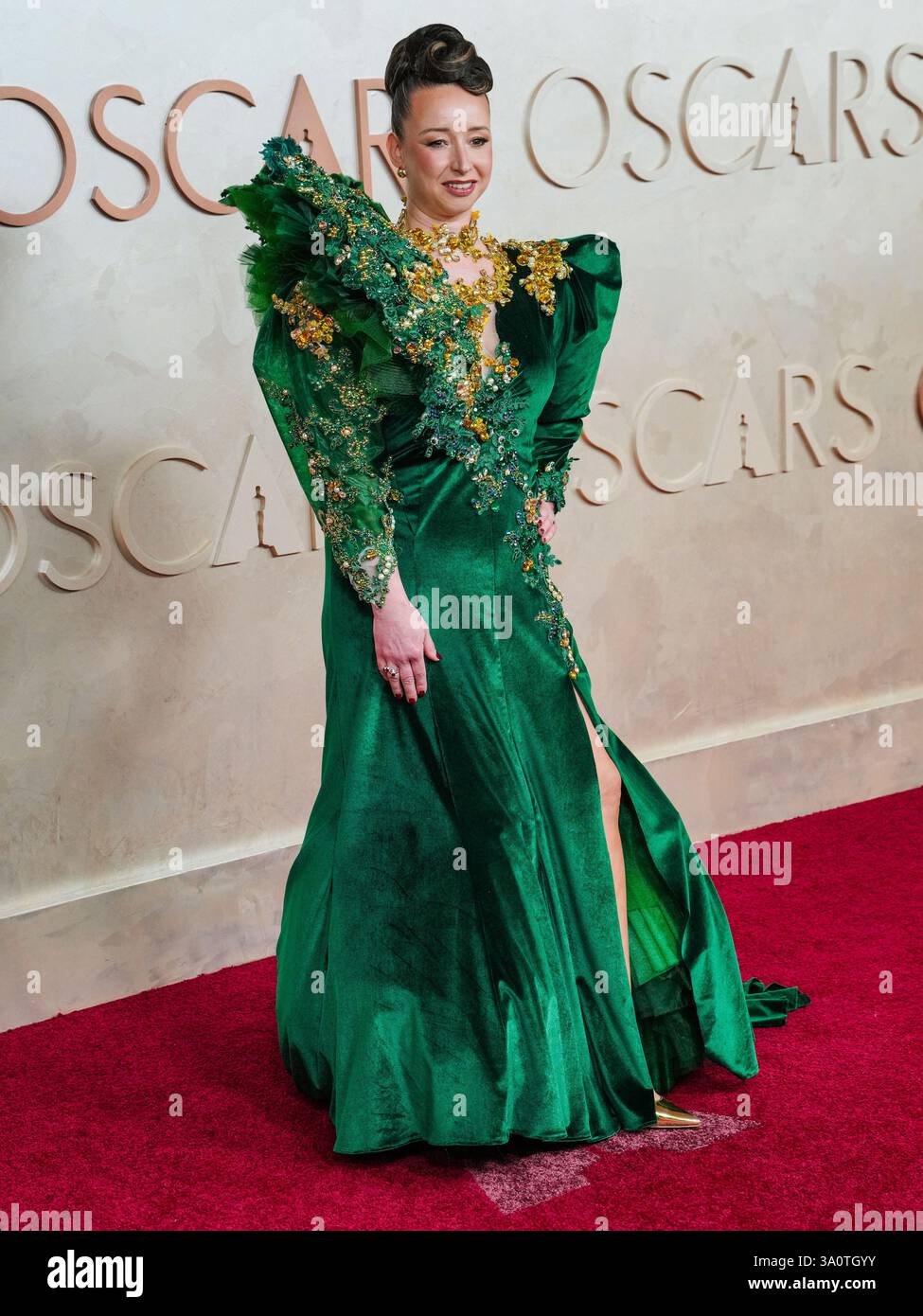 Laura Blount walking on the red carpet at the The 97th Academy Awards ...