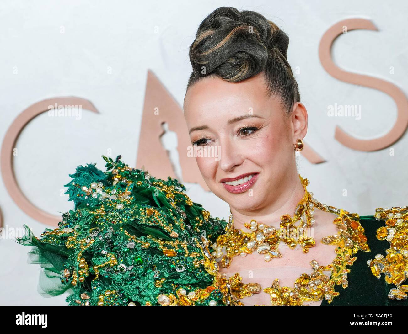 Laura Blount walking on the red carpet at the The 97th Academy Awards ...