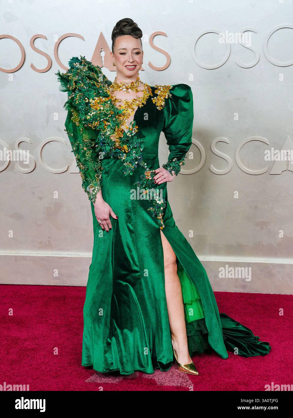 Laura Blount walking on the red carpet at the The 97th Academy Awards ...