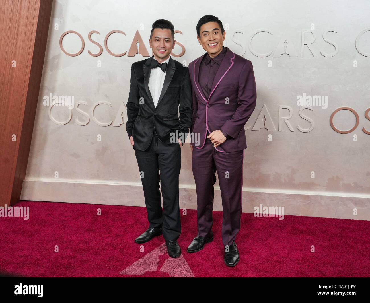 Jeremy Tran and Bing Chen walking on the red carpet at the The 97th ...