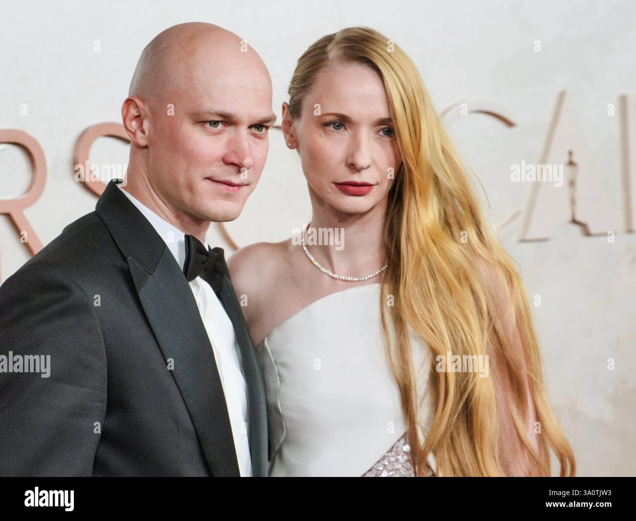 Yura Borisov, Anna Shevchuk walking on the red carpet at the The 97th ...
