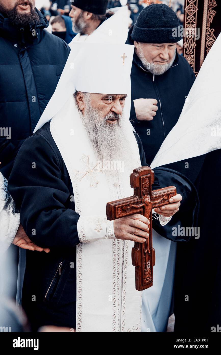 Saint Petersburg, Russia, 19 January 2022, Priest consecrating river water for baptism, holy ...