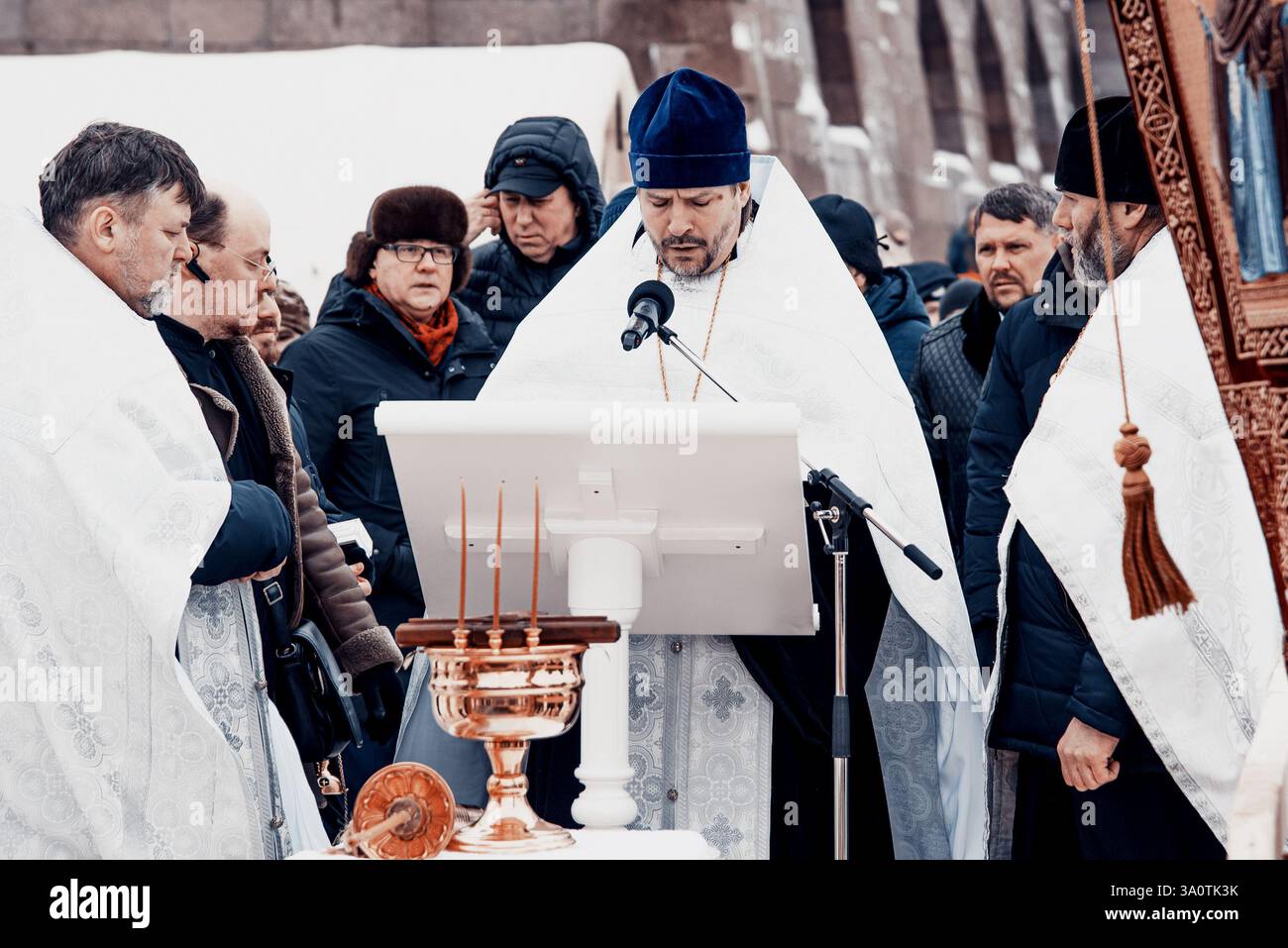 Saint Petersburg, Russia, 19 January 2022, Priest consecrating river water for baptism, holy ...