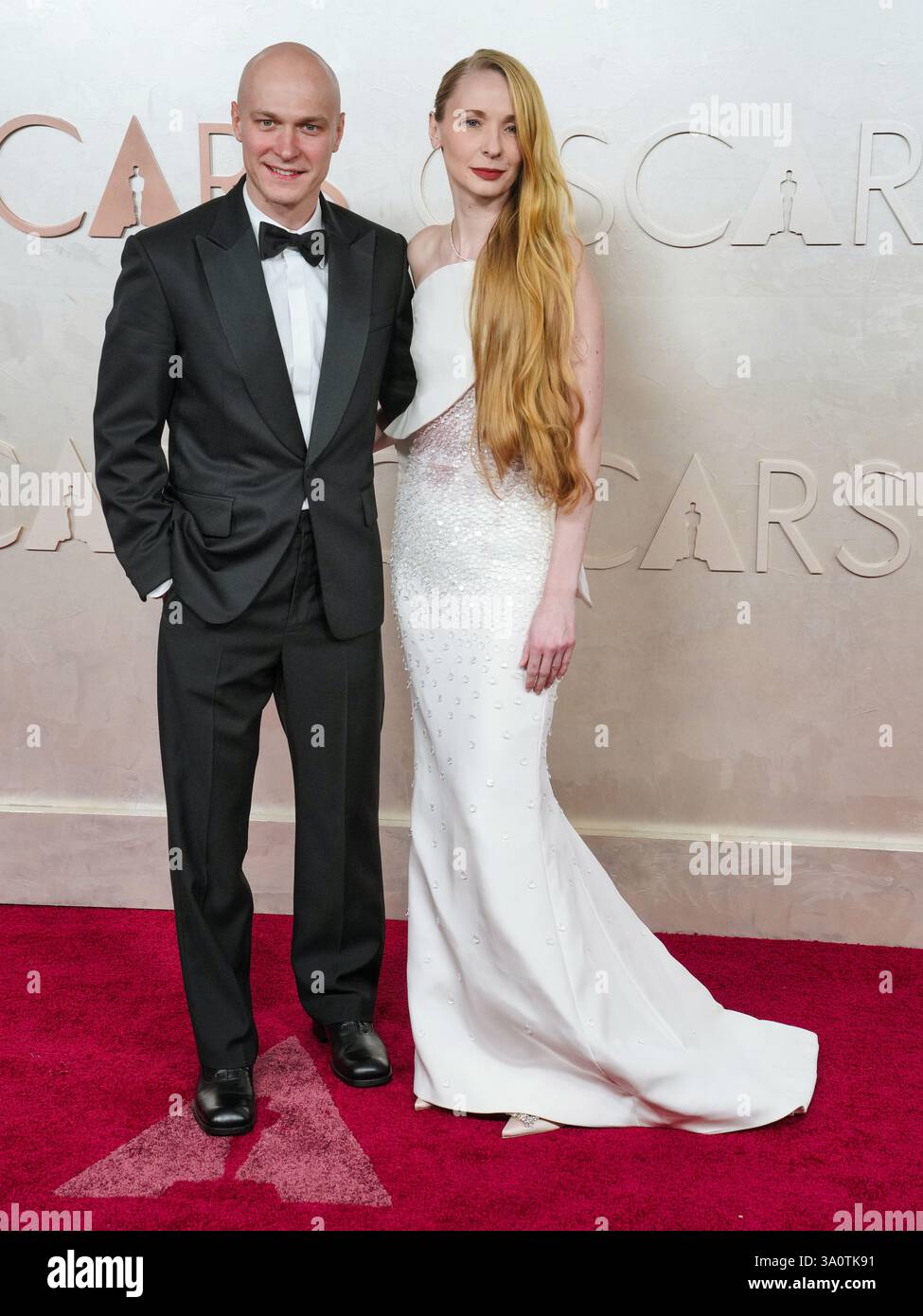 Yura Borisov, Anna Shevchuk walking on the red carpet at the The 97th ...
