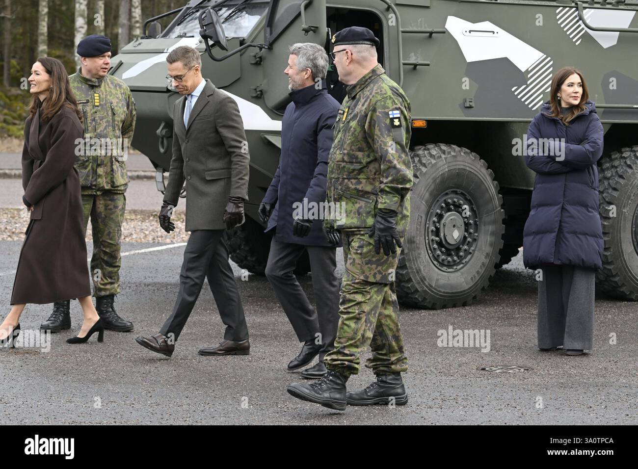 Finnish President Alexander Stubb (3L) and his spouse Suzanne Innes ...