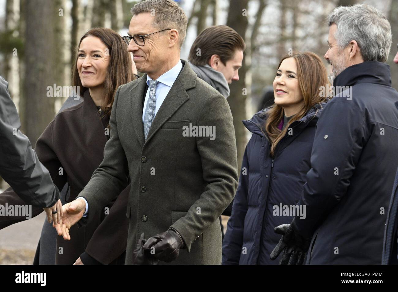 Finnish President Alexander Stubb (2L) and his spouse Suzanne Innes ...