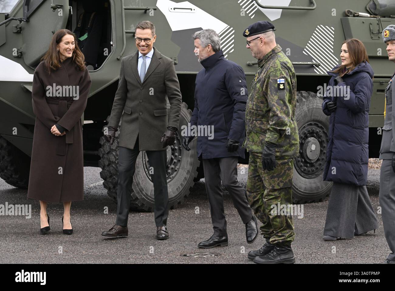 Finnish President Alexander Stubb (2L) and his spouse Suzanne Innes ...