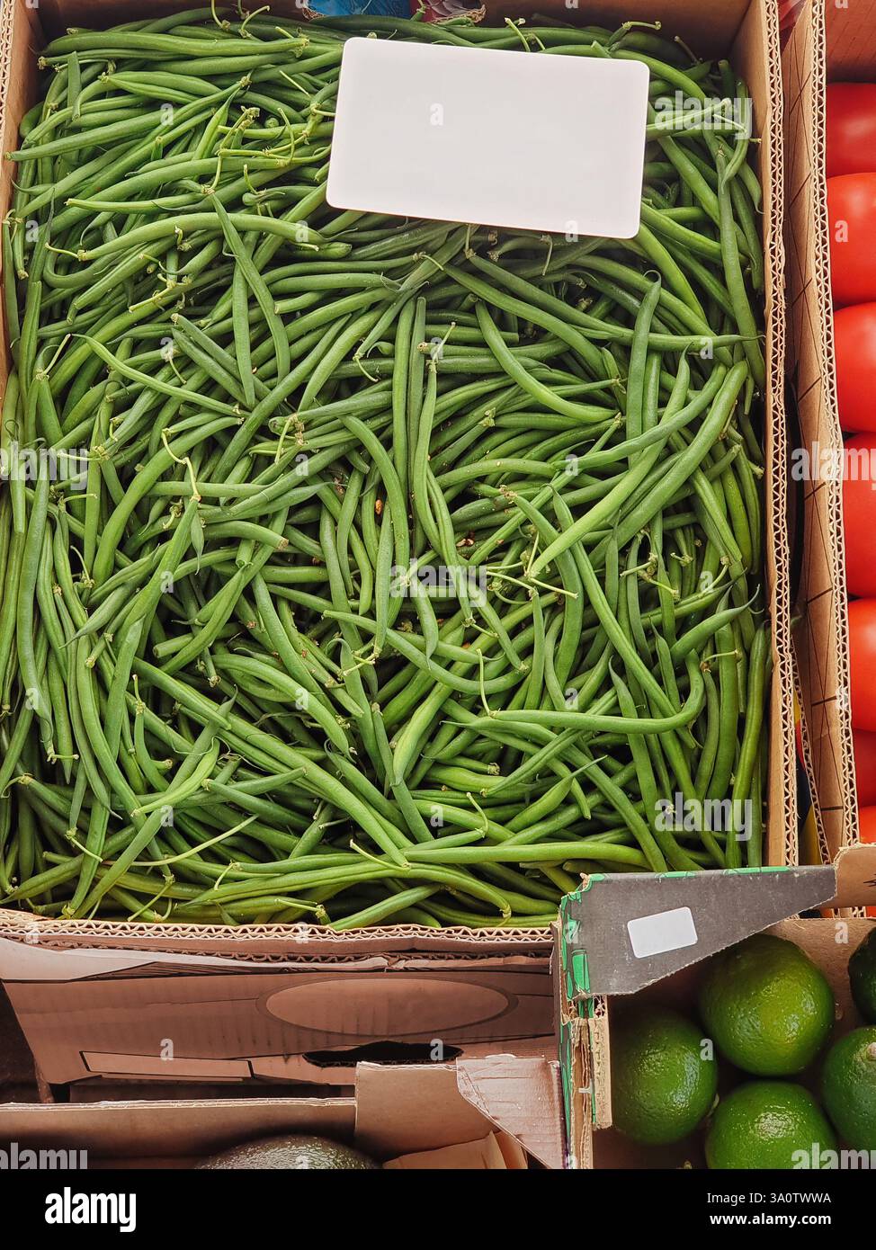 Green beans for sale on farmers market. Cardboard boxes with fresh ...