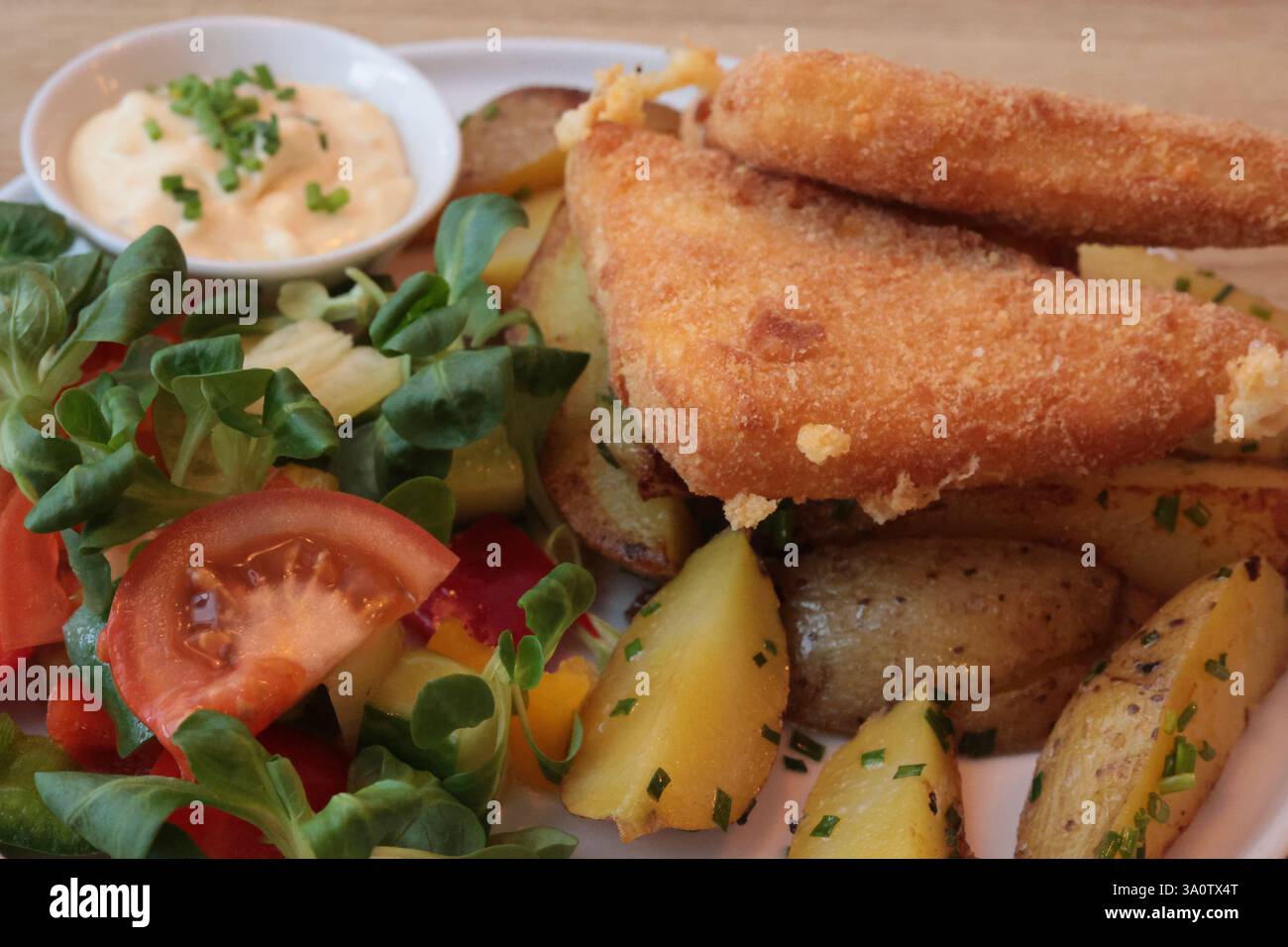 vegetarian meal without meat - fried cheese, baked potatoes, vegetable ...