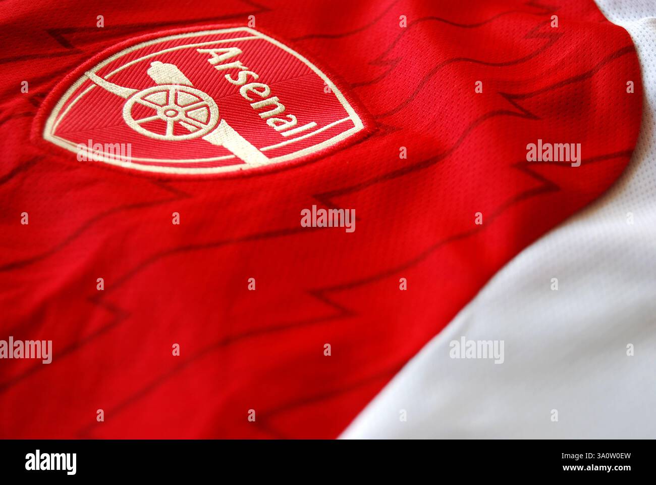 Angled close up photo of Arsenal FC club badge on the shirt with depth ...