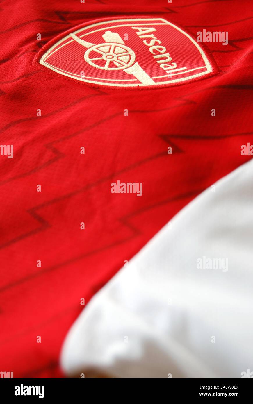 Angled close up photo of Arsenal FC club badge on the shirt with depth ...