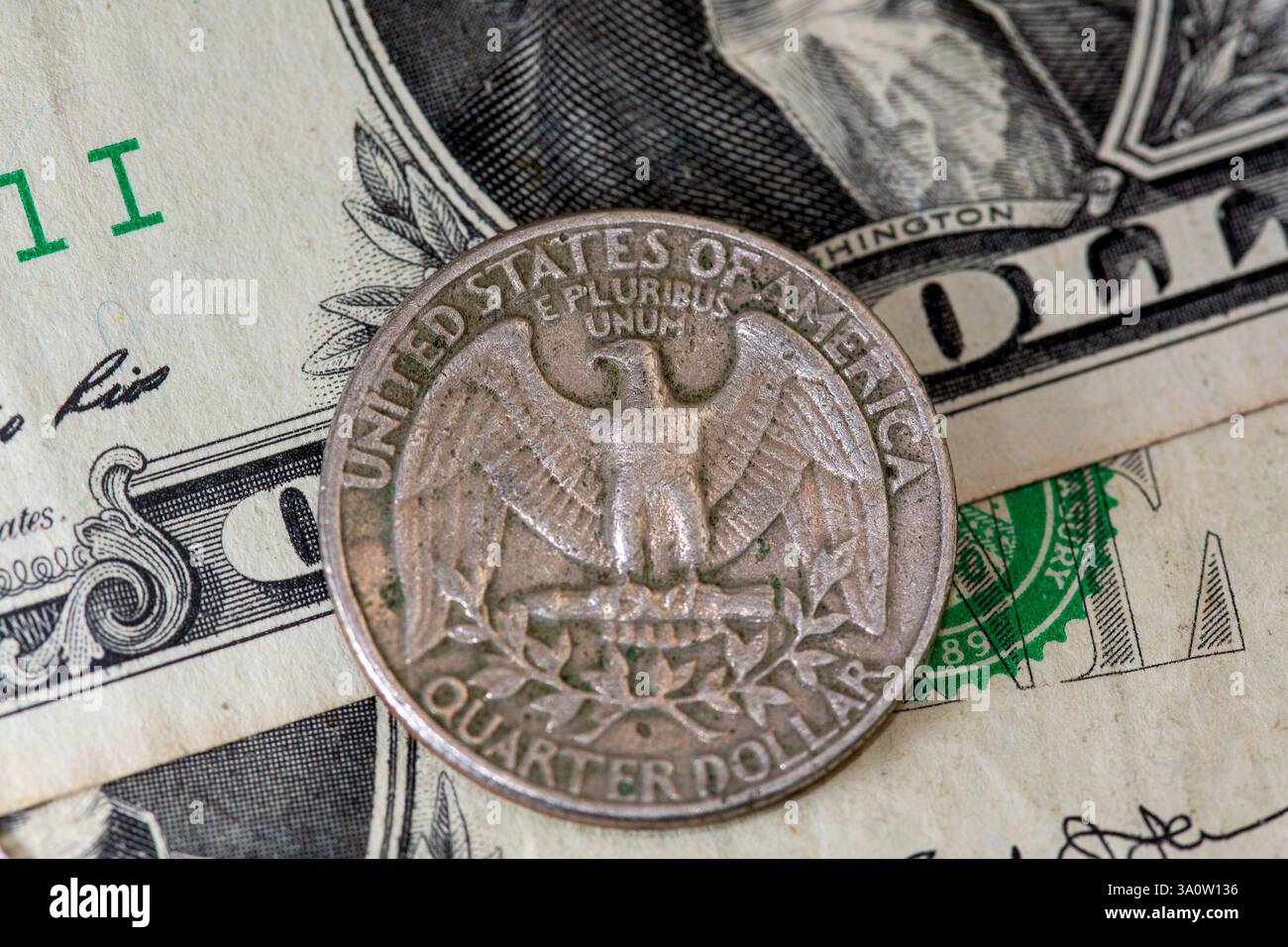 Berlin, Germany. 22nd Nov, 2024. A US quarter dollar coin lies on top ...