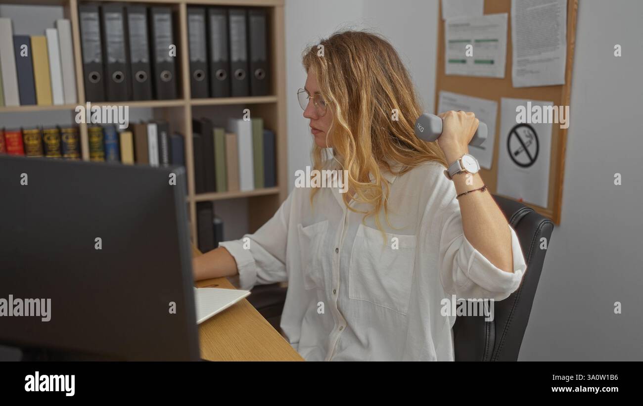 Young woman exercising with dumbbell in office room, surrounded by ...