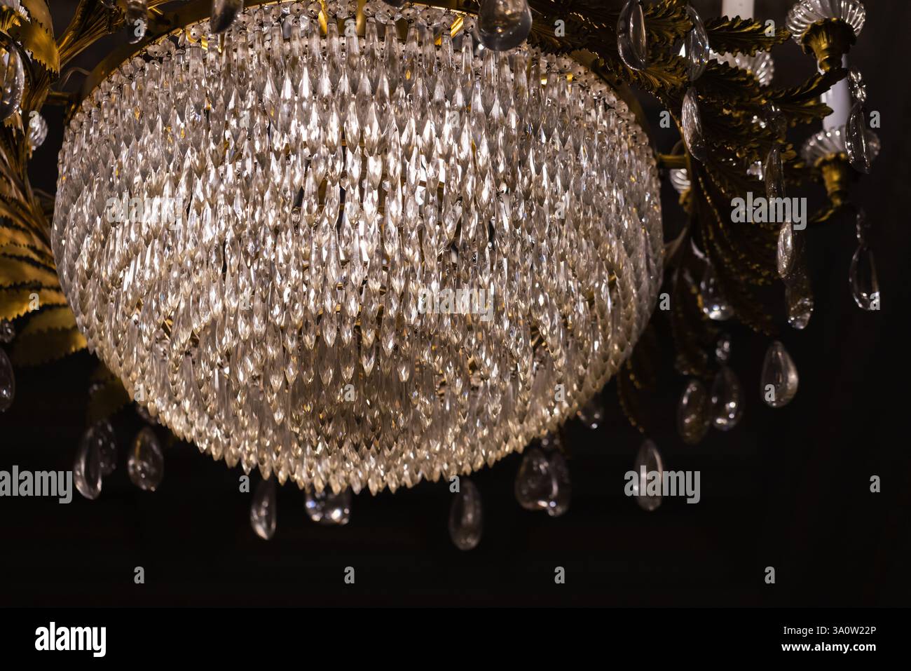 An ornate crystal chandelier showcases its intricate design and ...