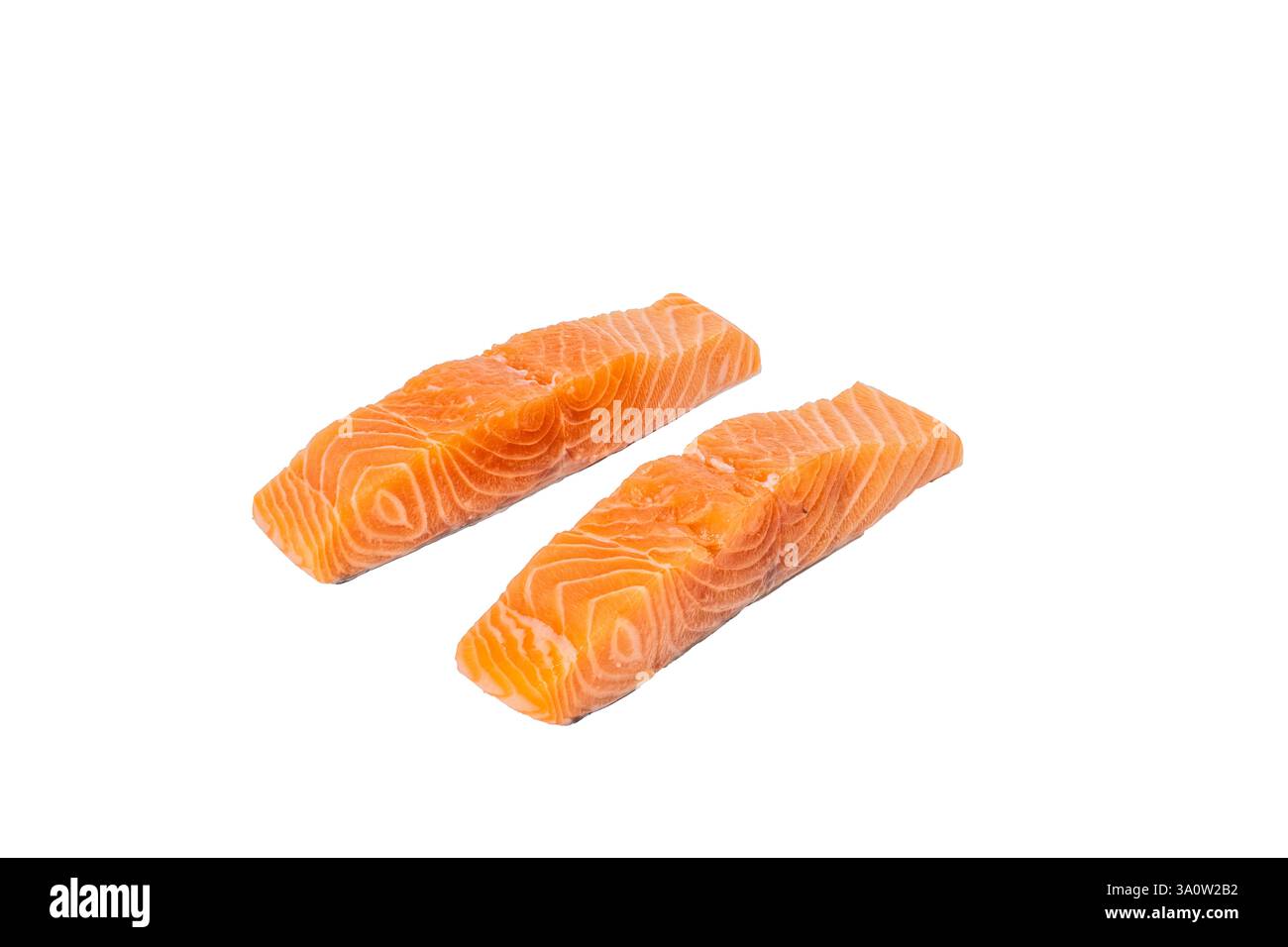 Two pieces of salmon are on a white background. The salmon is cut in ...