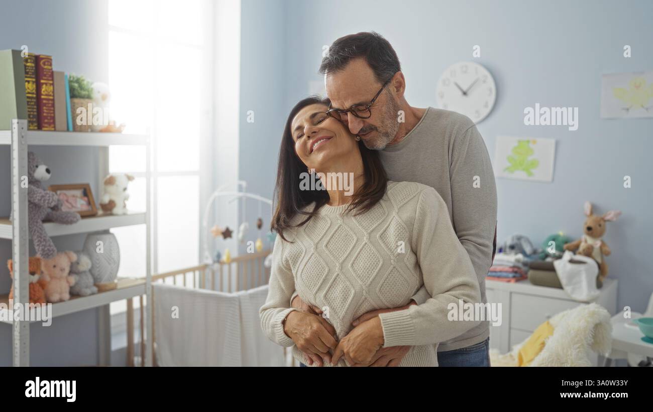 Family embraces in cozy bedroom hi-res stock photography and images - Alamy