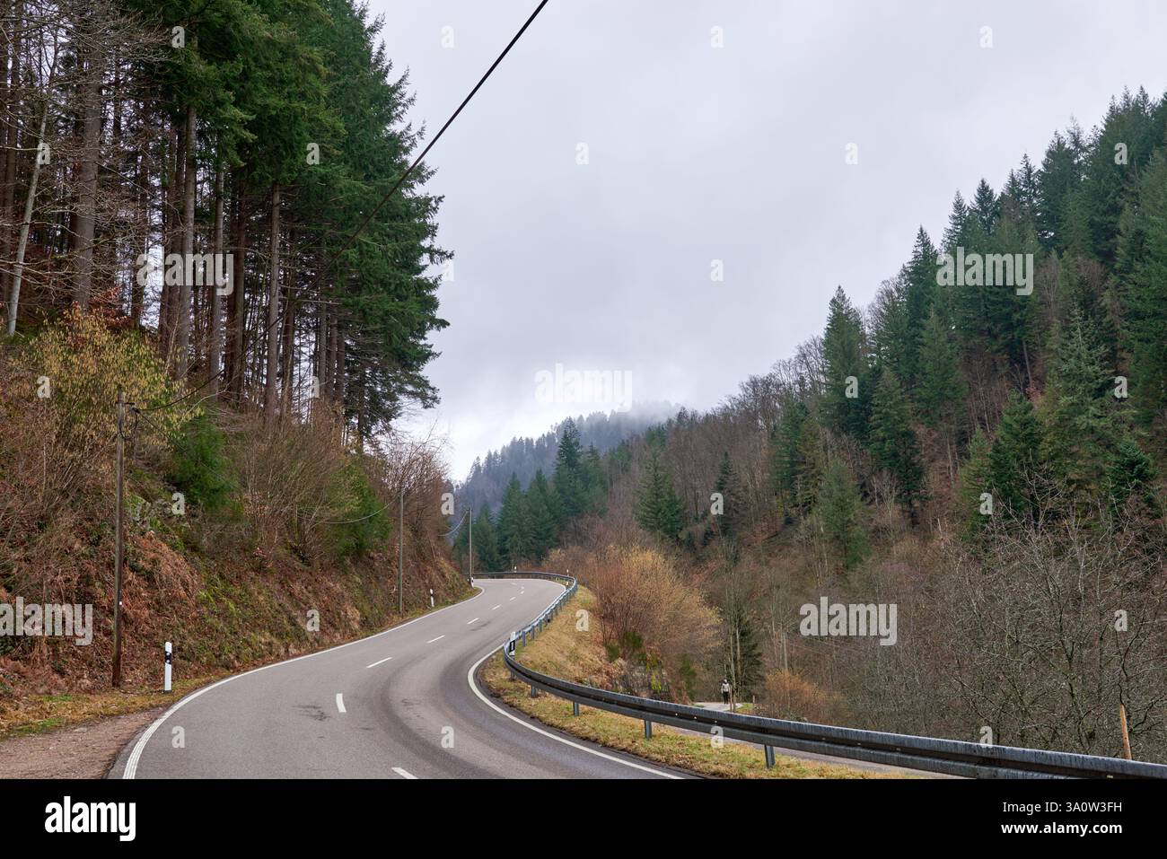 Beautiful mountain valley landscape featuring modern highway winding ...