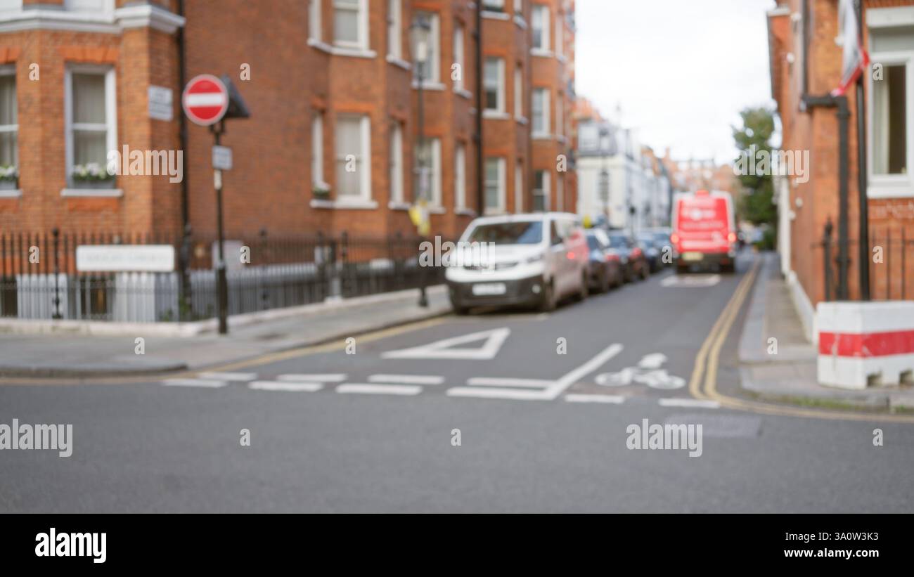 Blurred street scene in london featuring defocused cars and traditional ...