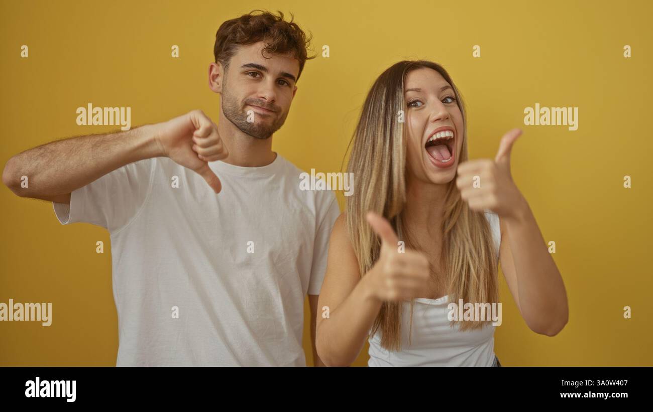 Man and woman expressing opposite reactions with thumbs up and thumbs ...