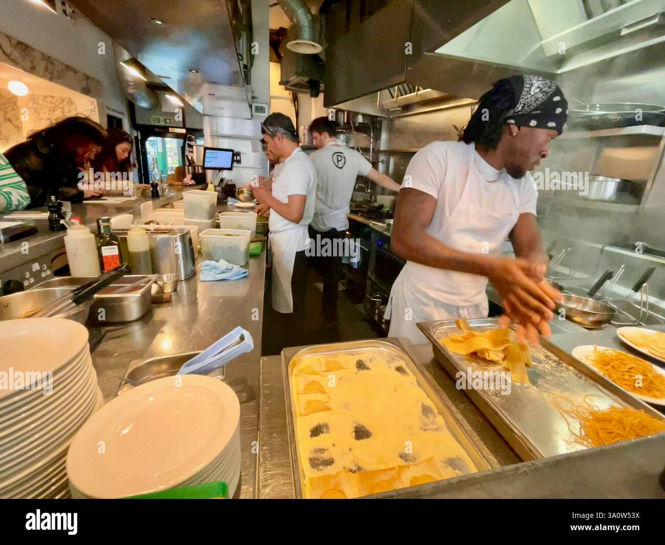 the kitchen of padella borough Italian restaurant with staff cooking ...