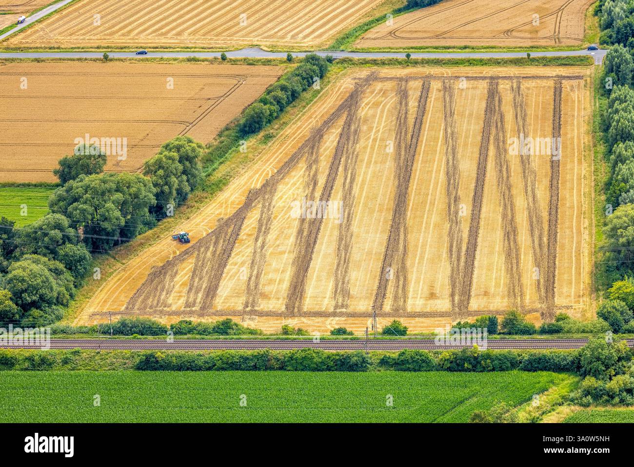 Aerial view, traces in the landscape, agricultural field work with ...