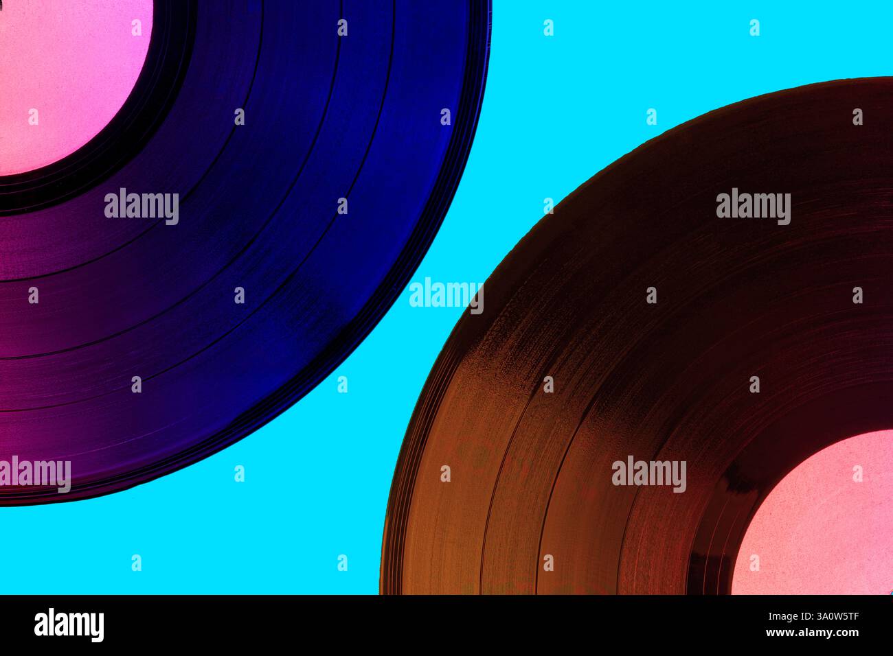 A vibrant close-up of two vinyl records with iridescent colors set ...