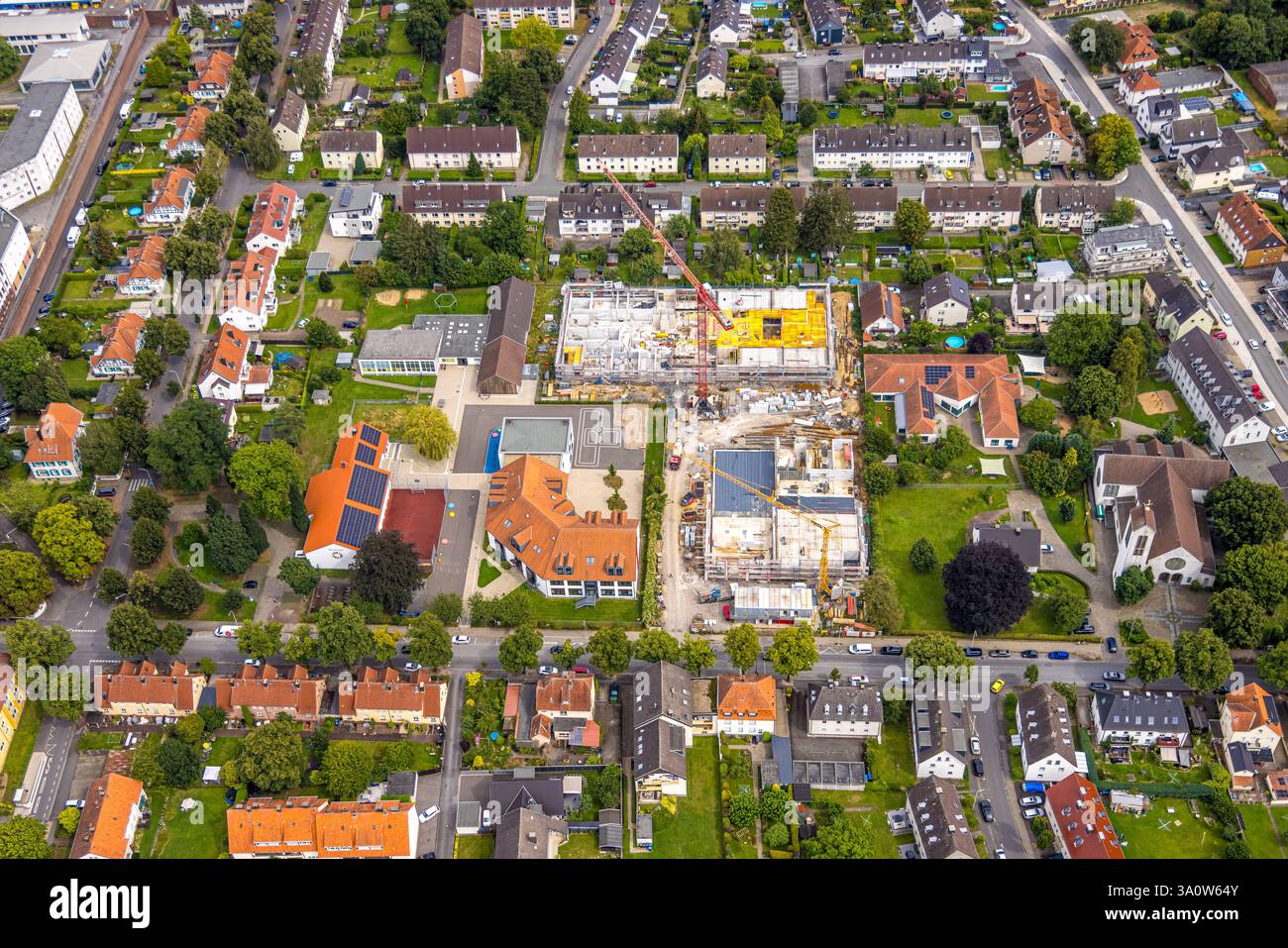 Aerial view, construction site with construction crane and new school ...